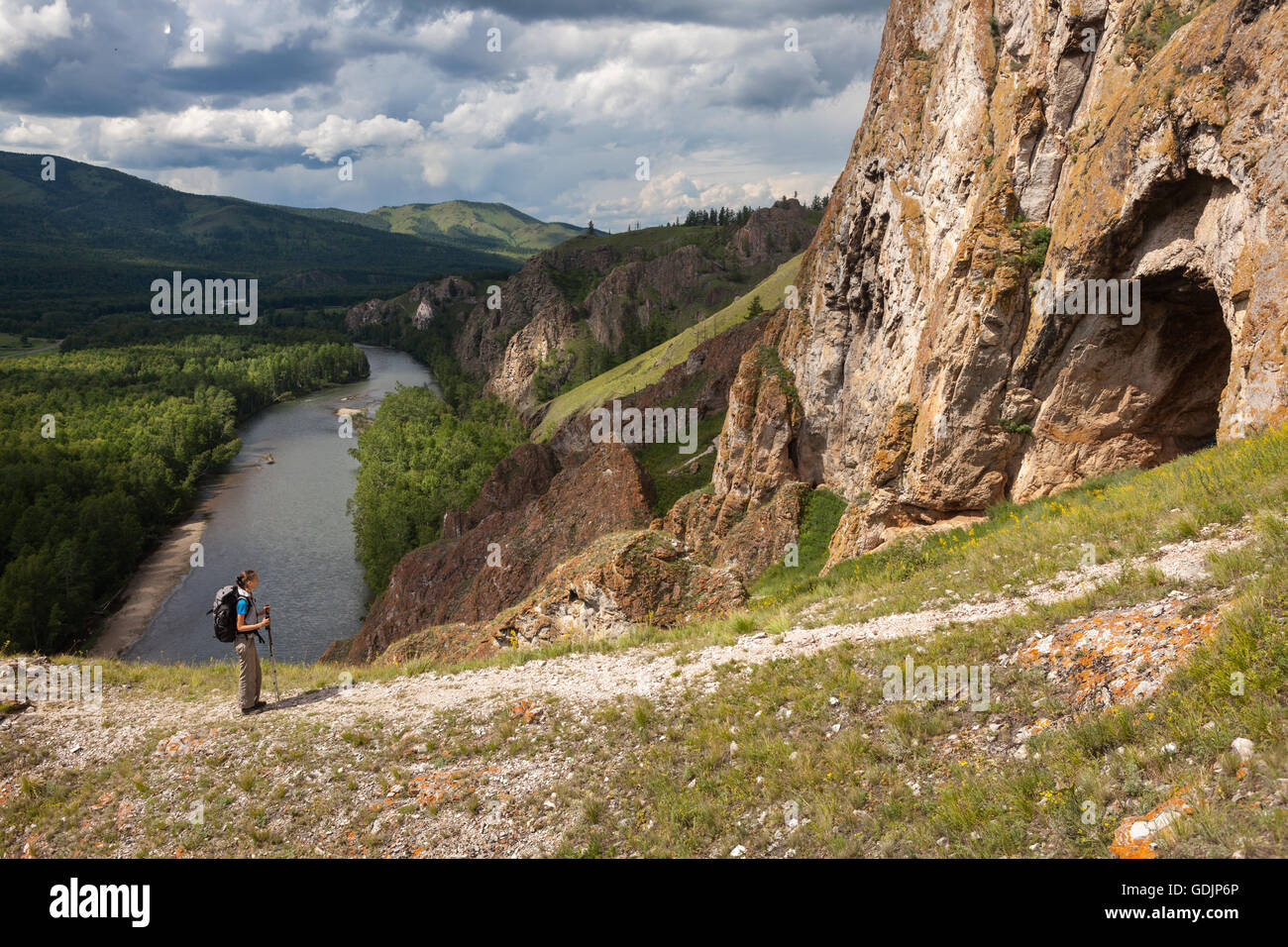 Tourist with a backpack and mountain panorama Stock Photo - Alamy