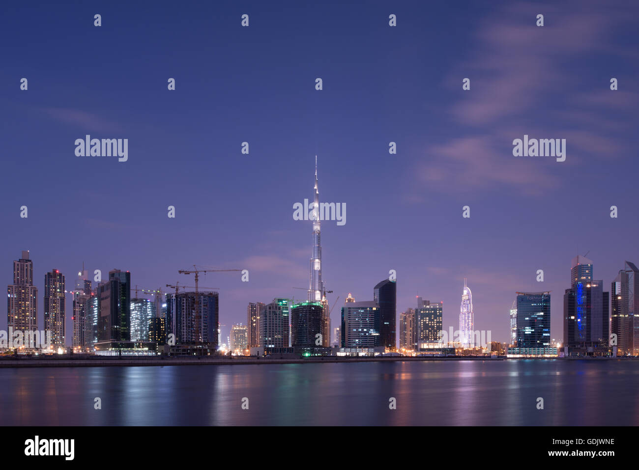 Evening shot of Dubai Skyline modern buildings and the Burj Khalifa ...