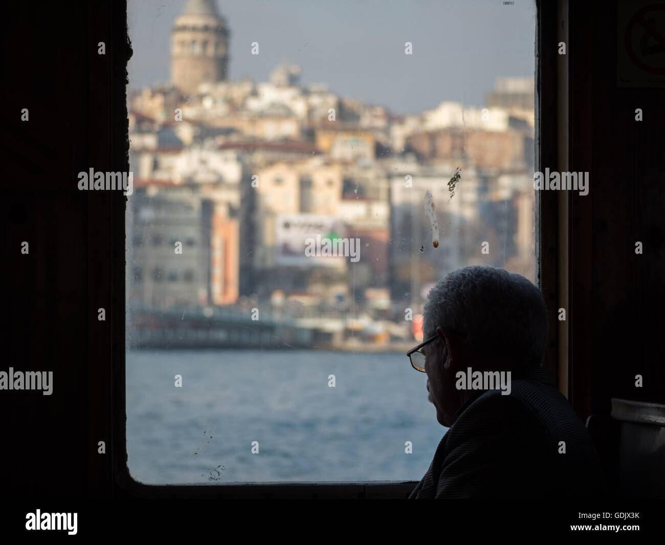 Man looking out through ship window in Istanbul, Turkey Stock Photo - Alamy