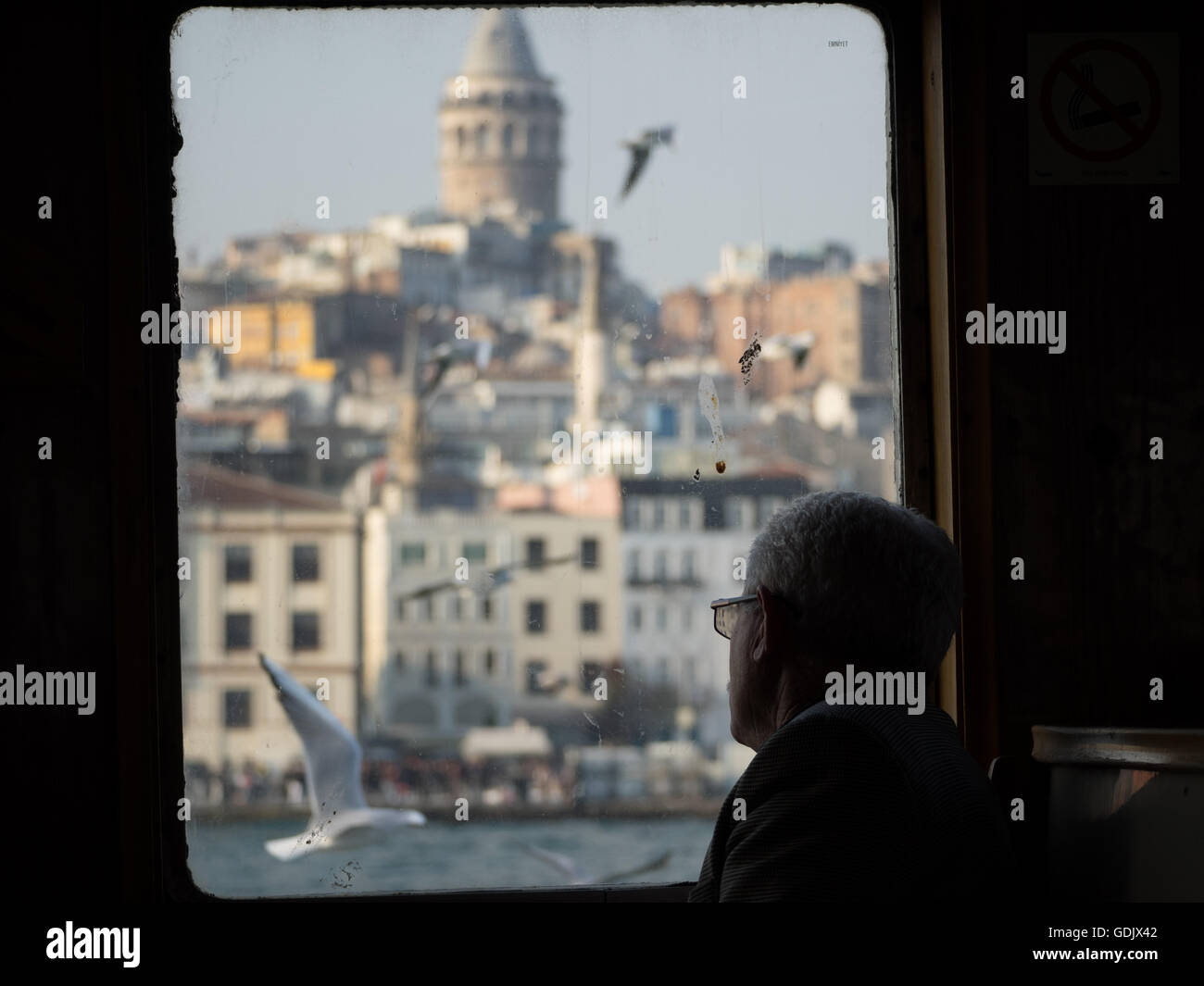 Man looking out through ship window in Istanbul, Turkey Stock Photo - Alamy