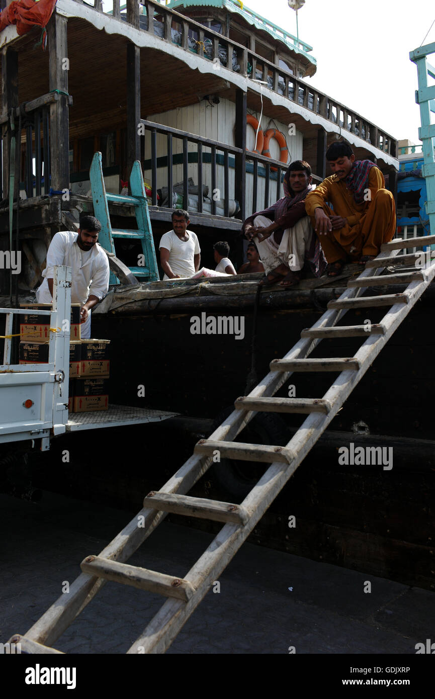 Workers waiting for a work, Dubai, United Arab Emirates Stock Photo - Alamy