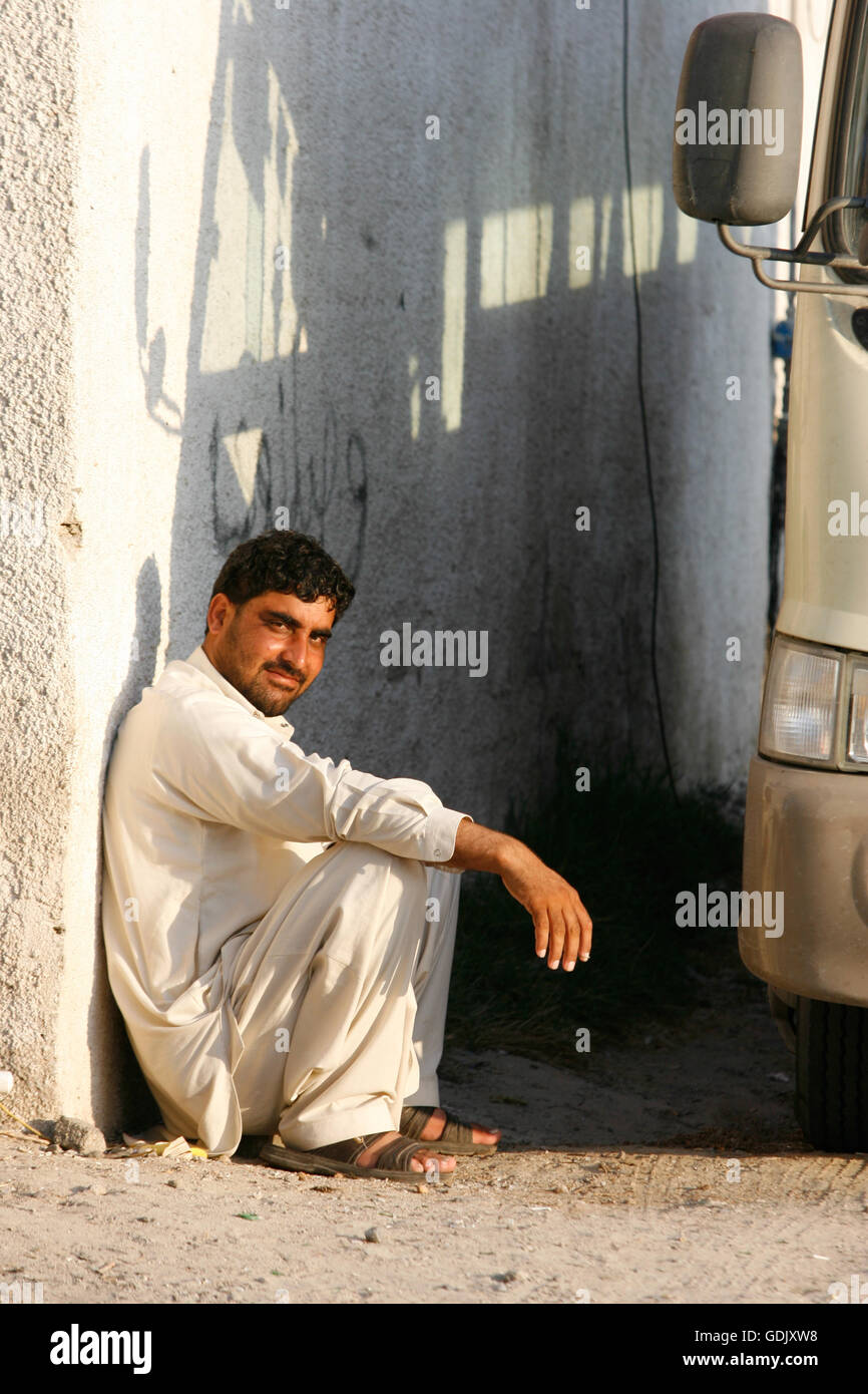 Pakistani bus driver resting in Satwa, Dubai, United Arab Emirates ...
