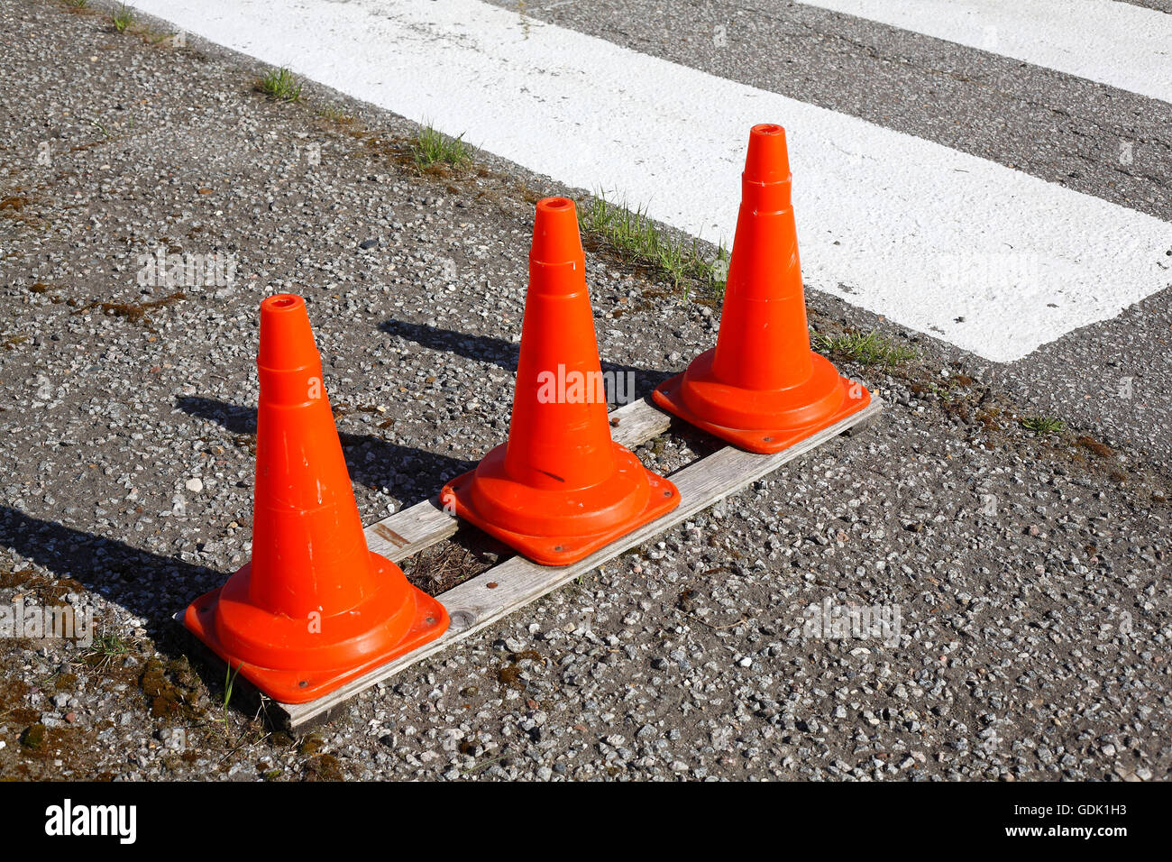 Aircraft - Three red Traffic cone with a shadow from the setting sun ...