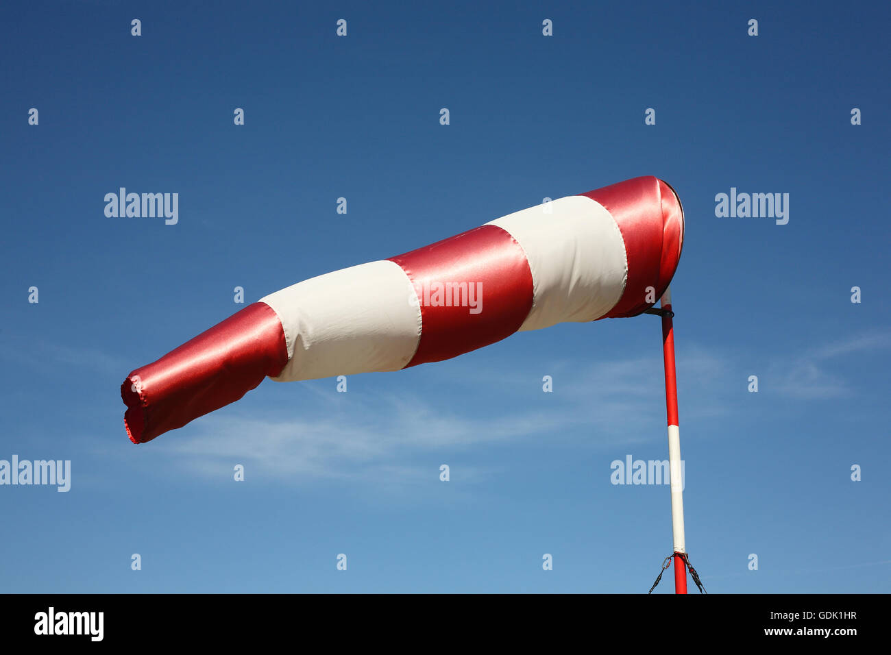 Windsock the cloudy sky background. Wind southwest Stock Photo - Alamy