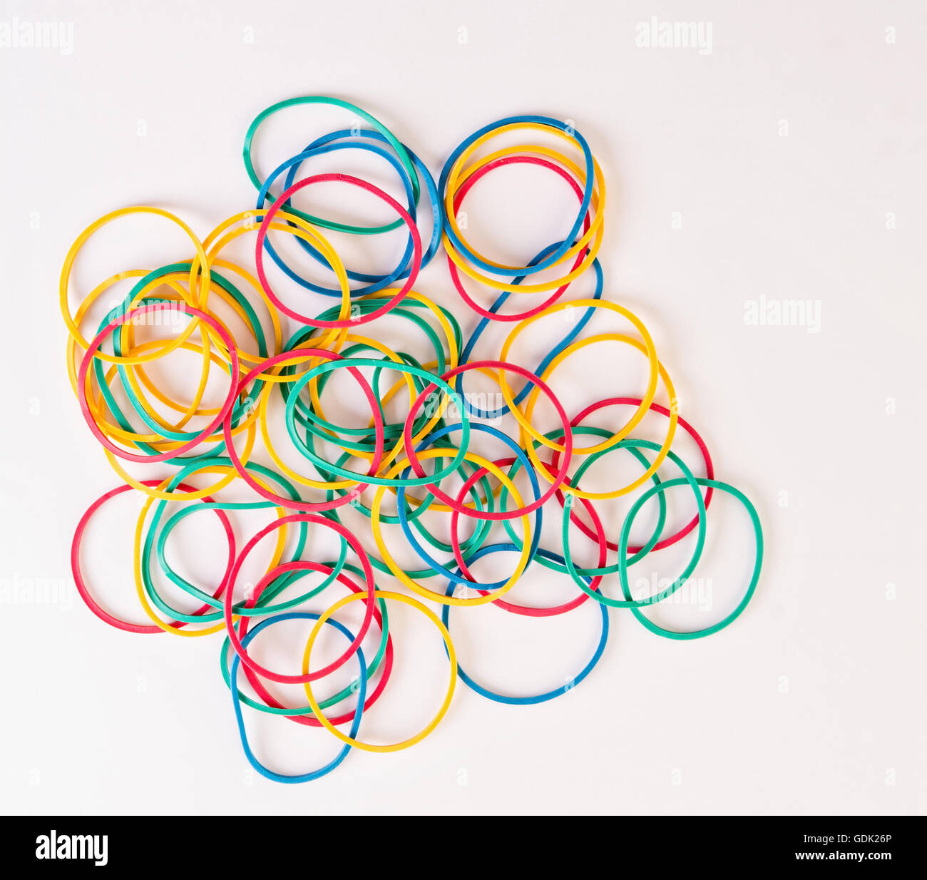 pile of rubber bands of different colors on white Stock Photo - Alamy