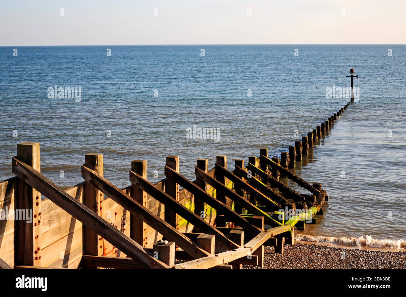 A traditional wooden breakwater on the north Norfolk coast at ...