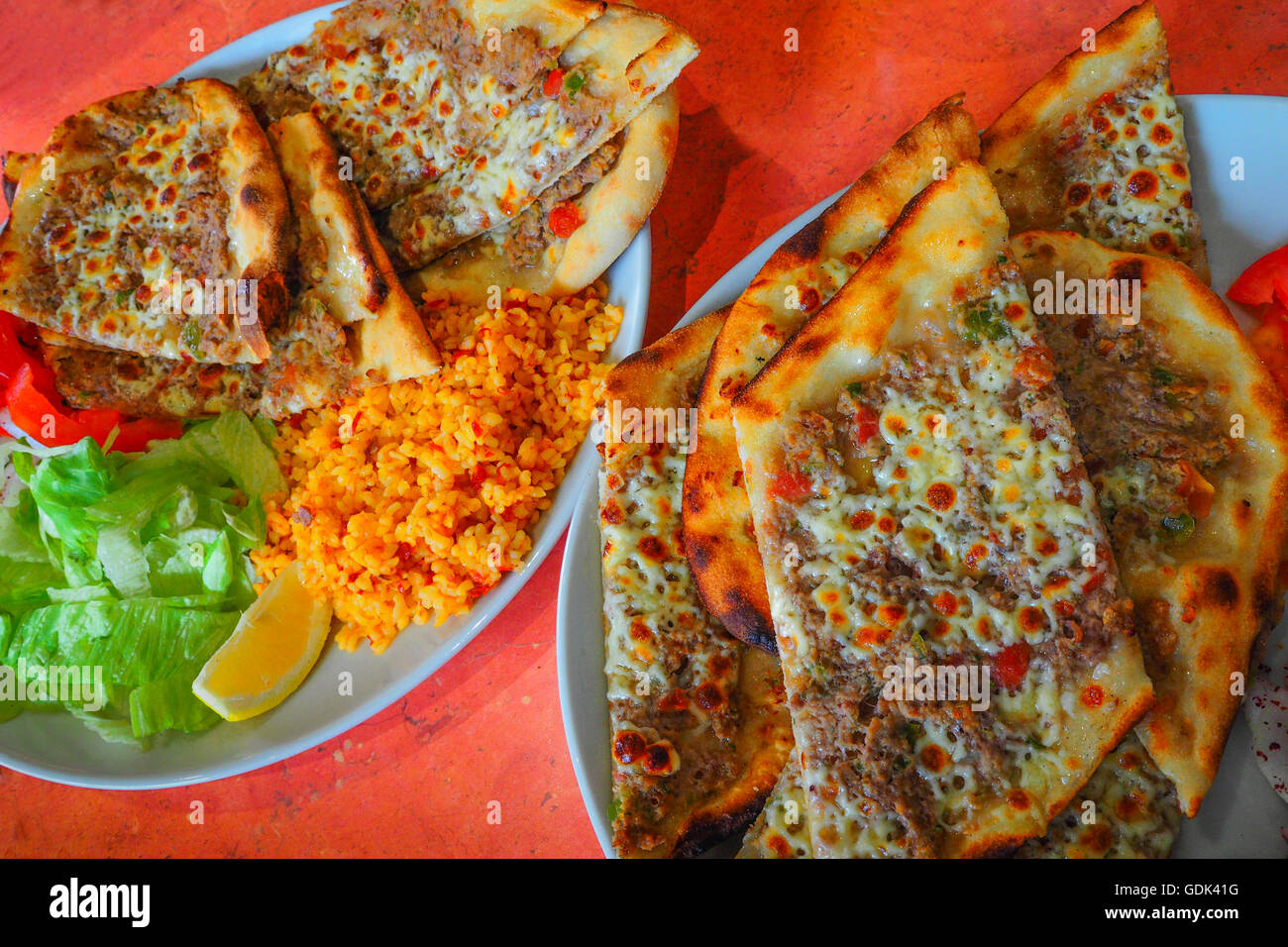 Lahmacun, is a round, thin piece of dough topped with minced meat (most ...
