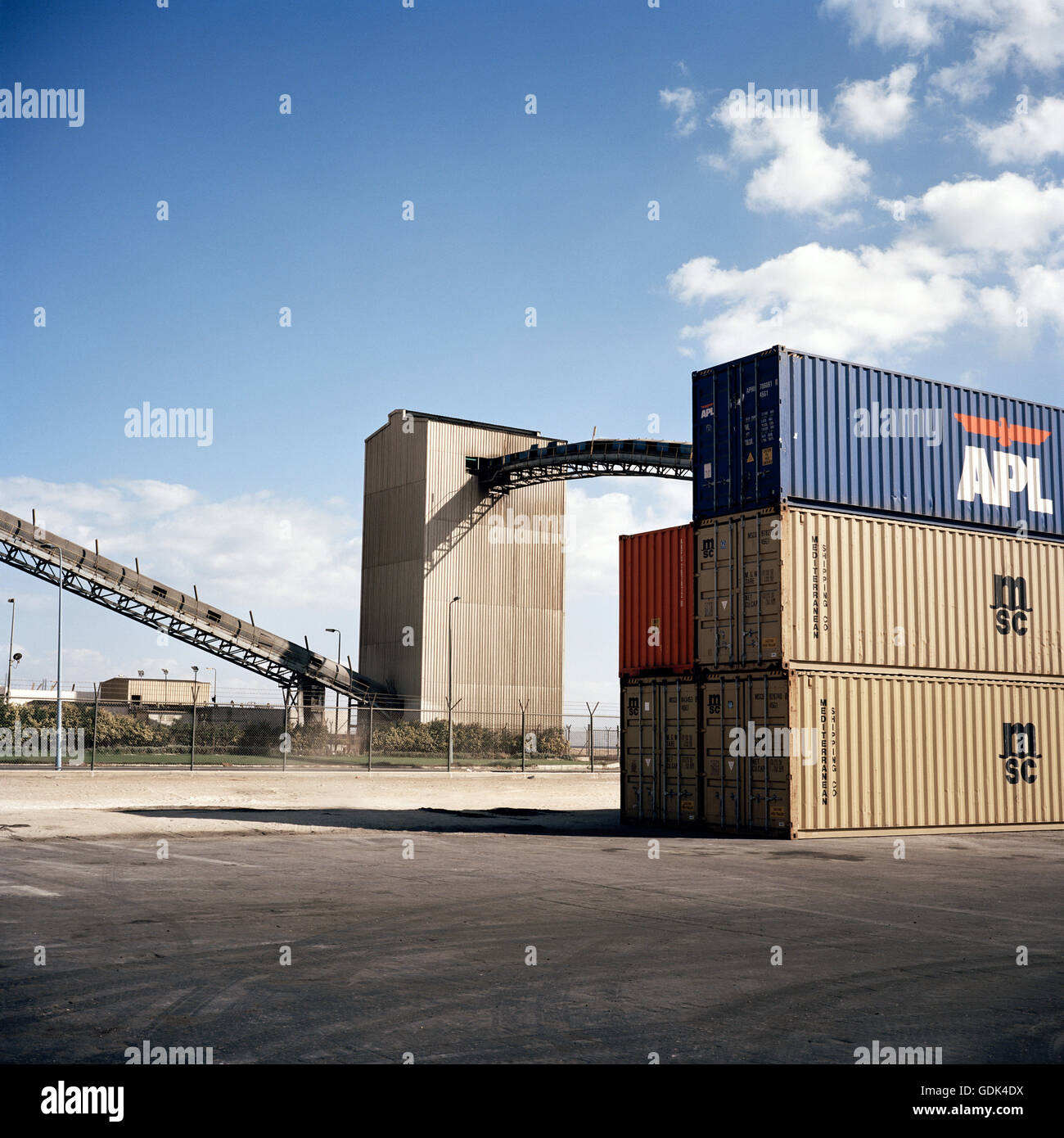 Containers wait inside the Dubai owned container port alongside the Red ...