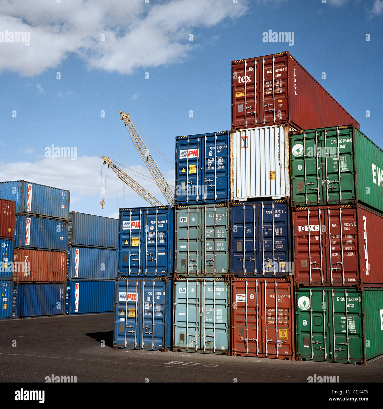Containers wait inside the Dubai owned container port alongside the Red ...