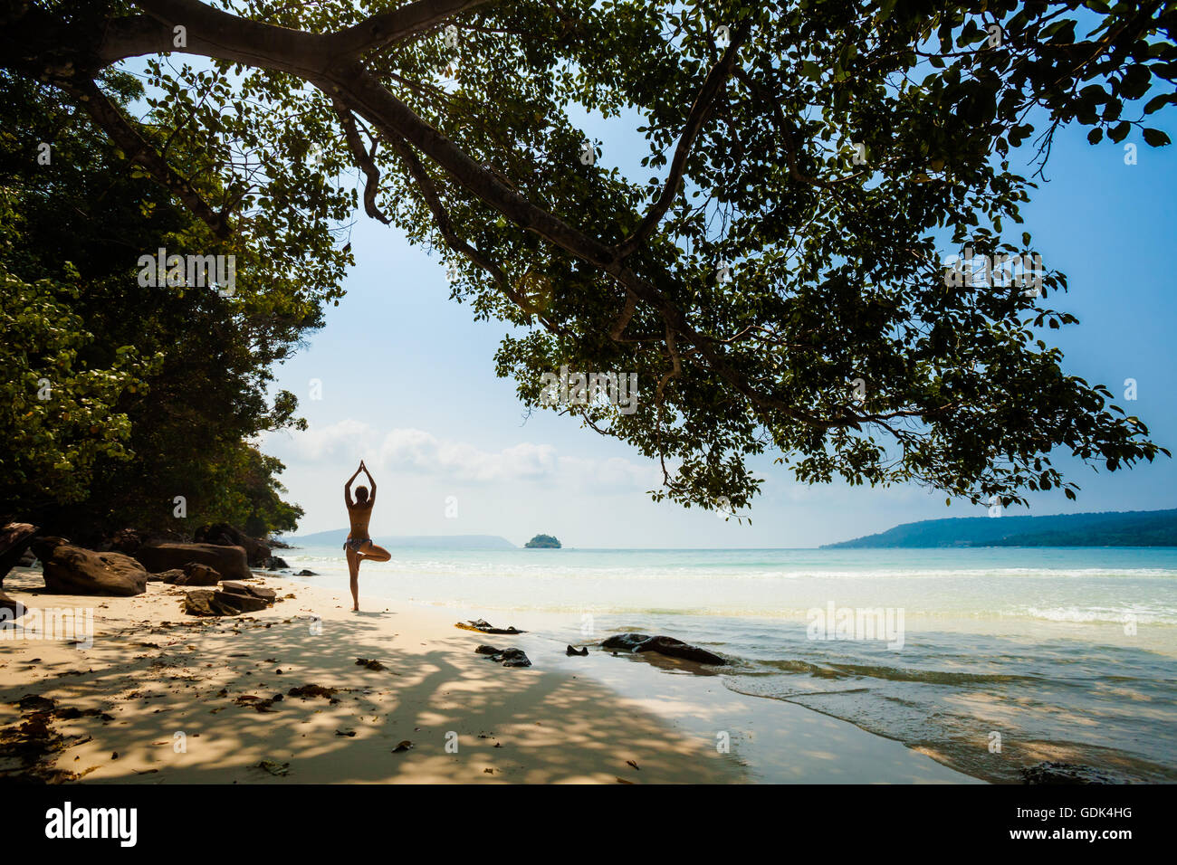Summer yoga session on a beach - tropical Koh Rong island, Cambodia ...