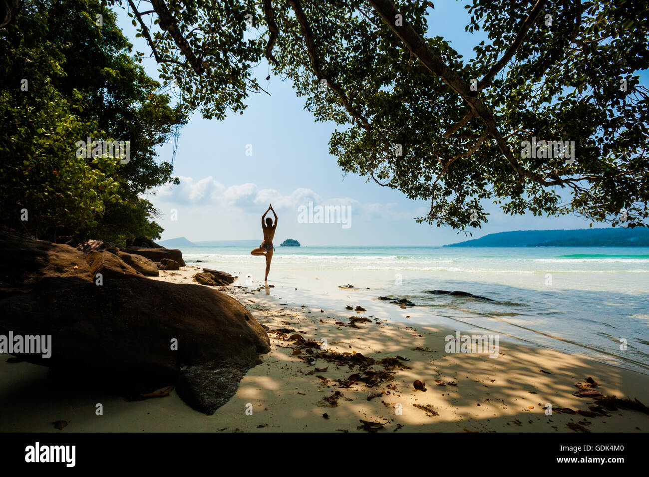 Summer yoga session on a beach - tropical Koh Rong island, Cambodia ...