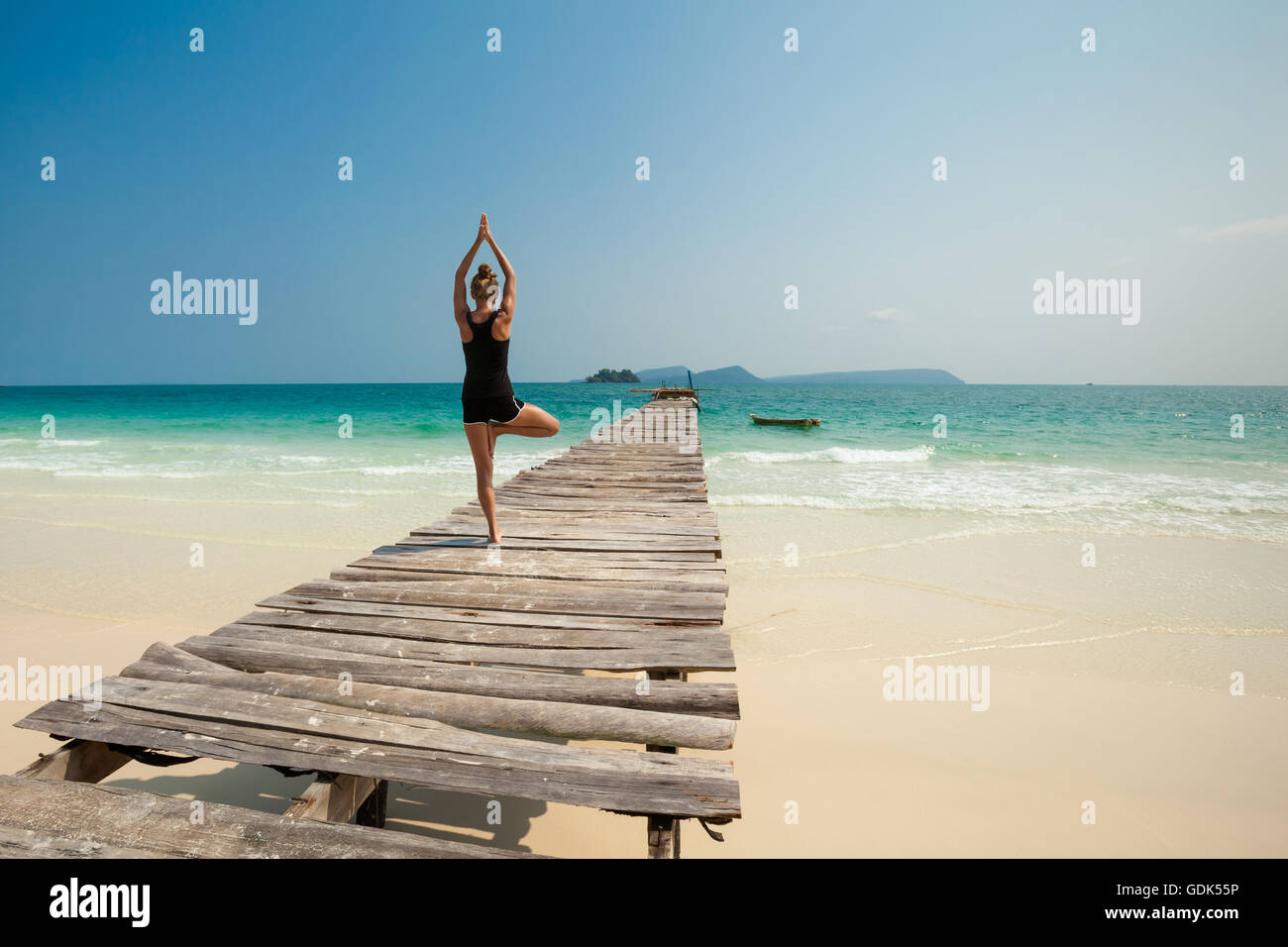 Summer yoga session on a beach - tropical Koh Rong island, Cambodia ...
