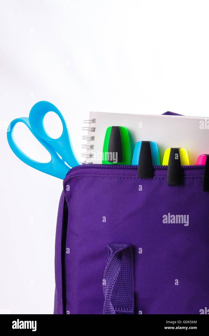 Open purple backpack with school supplies on white background. Back to ...