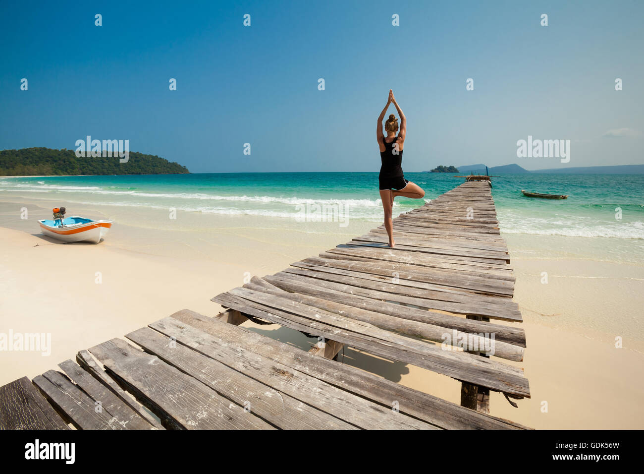 Summer yoga session on a beach - tropical Koh Rong island, Cambodia ...