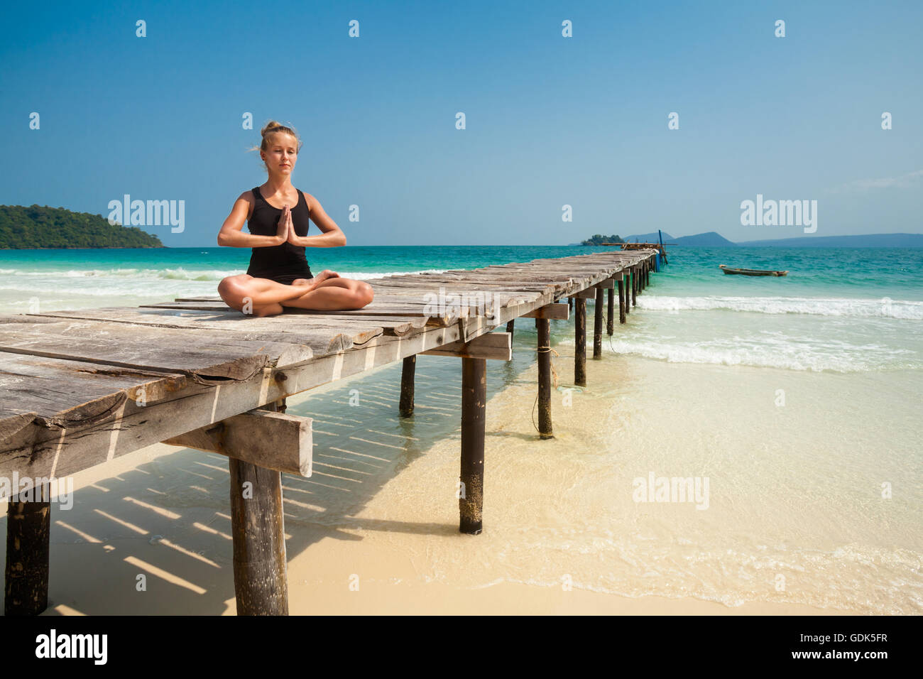 Summer yoga session on a beach - tropical Koh Rong island, Cambodia ...