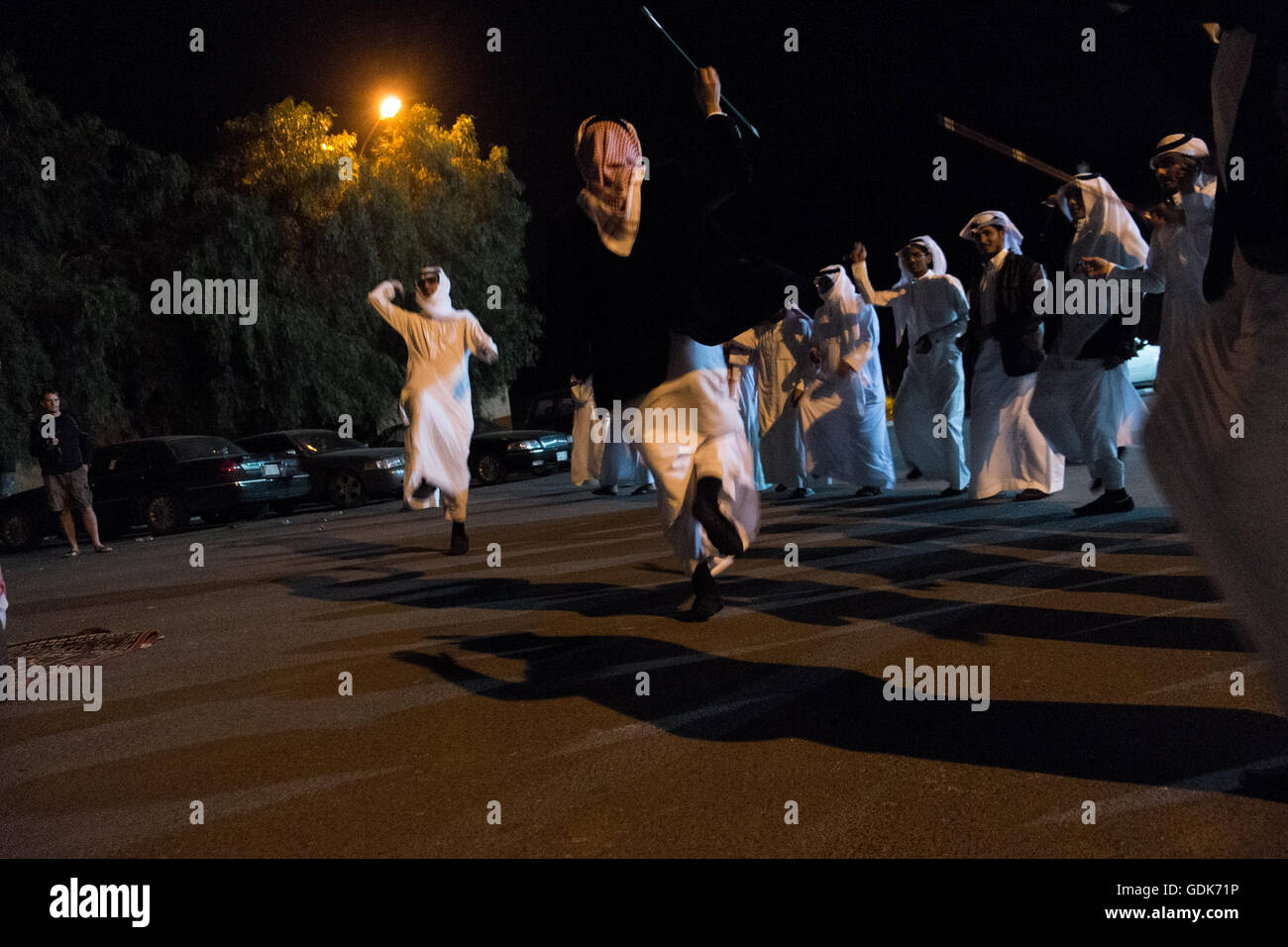 Young men perform a traditional dance for tourists at a hotel on a ...