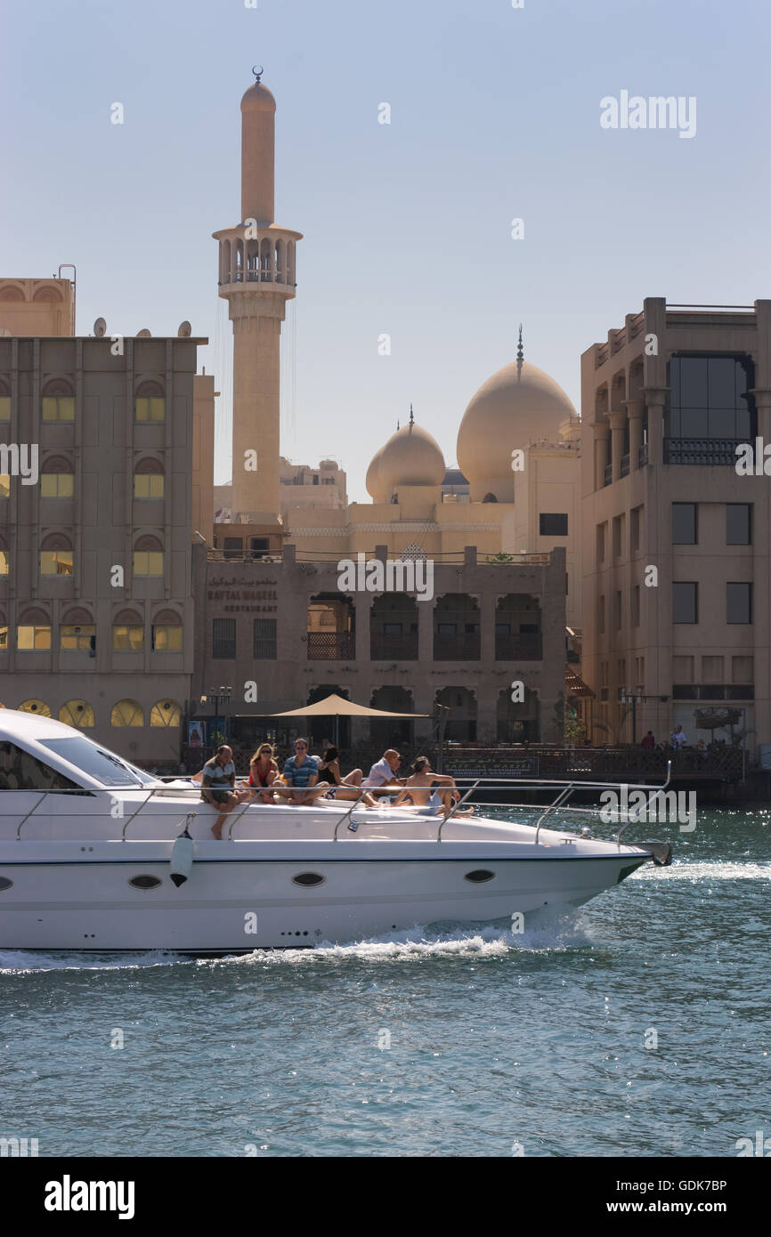 Modern boat on Dubai Creek passing the Grand Mosque in Bur Dubai Stock ...