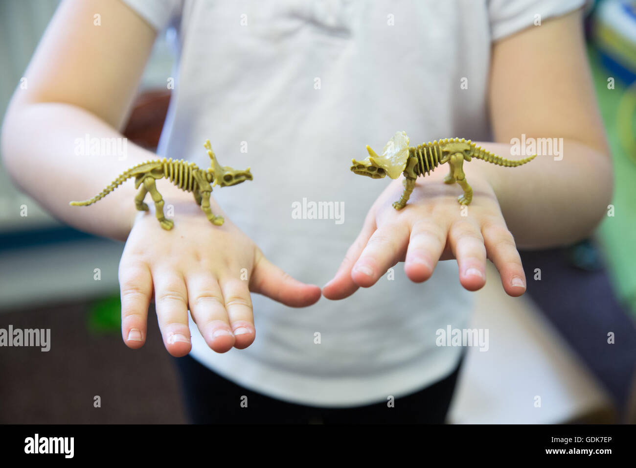 Toy dinosaur hand hi-res stock photography and images - Alamy