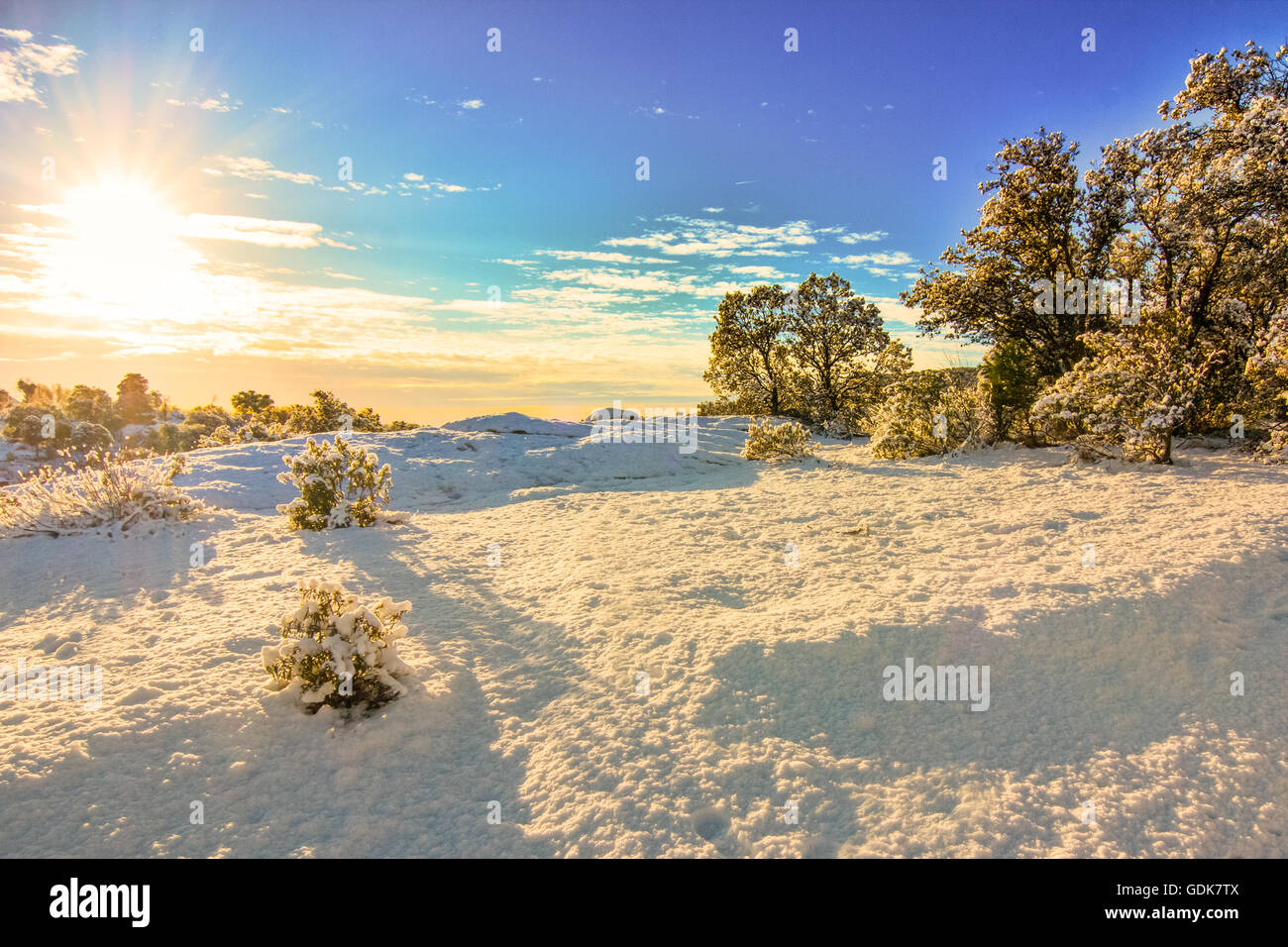 snowy landscape with blue sky and white clouds Stock Photo - Alamy
