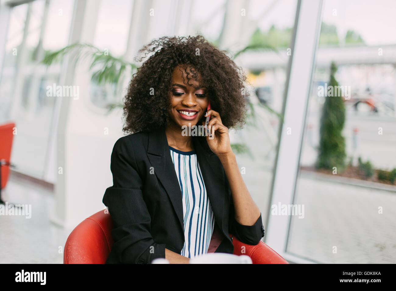 Vivacious beautiful young African American lady with afro hairstyle ...