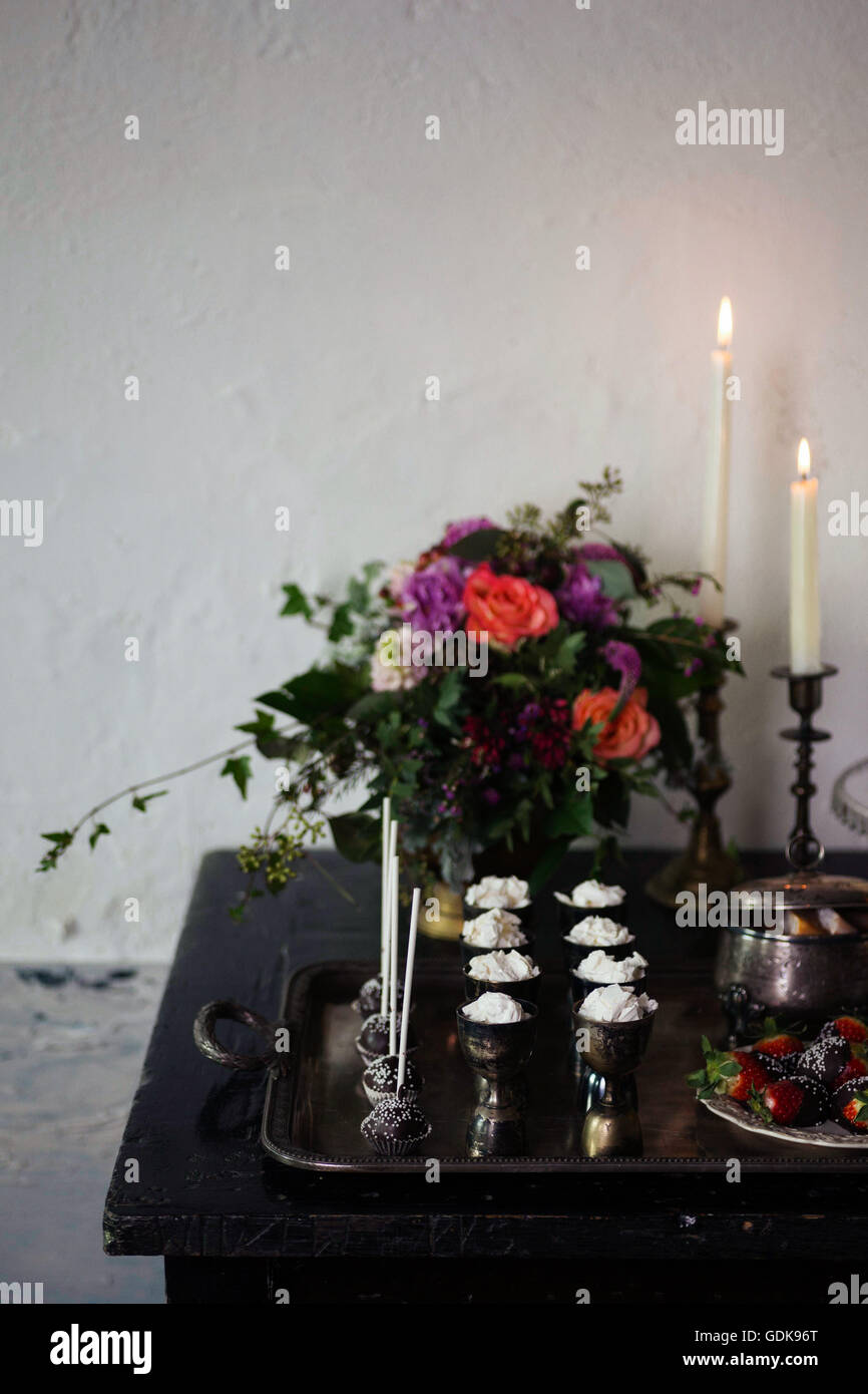 Detail shot of sweet table inspired by Dutch masters still lifes. Dark ...