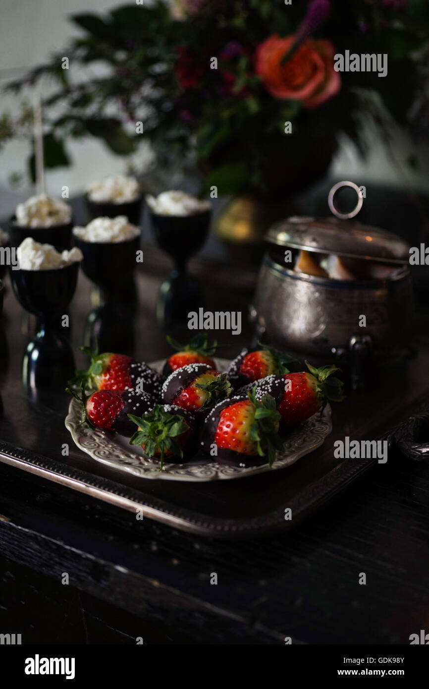 Detail shot of sweet table inspired by Dutch masters still lifes. Dark ...