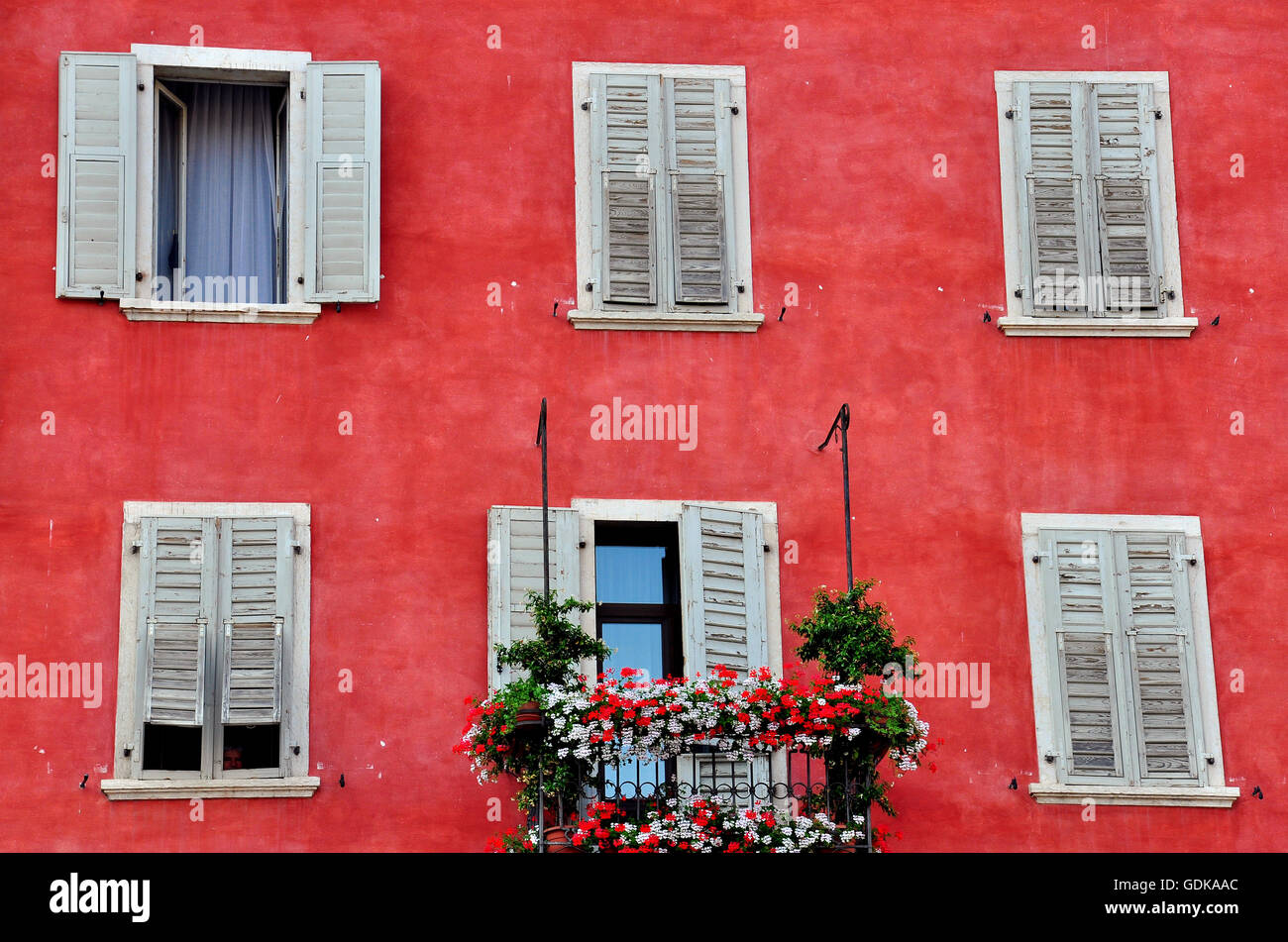 Windows of the red italian house Stock Photo - Alamy