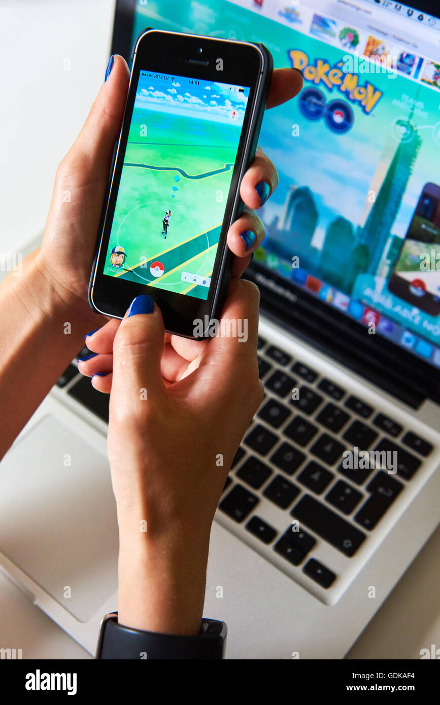 Woman playing a Pokemon Go game Stock Photo - Alamy