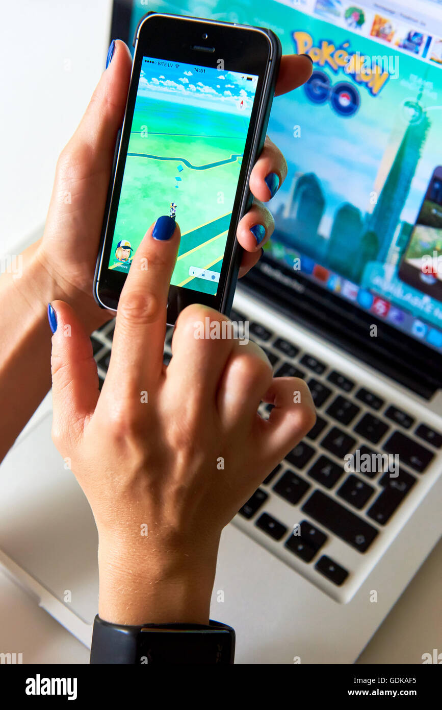 Woman playing a Pokemon Go game Stock Photo - Alamy