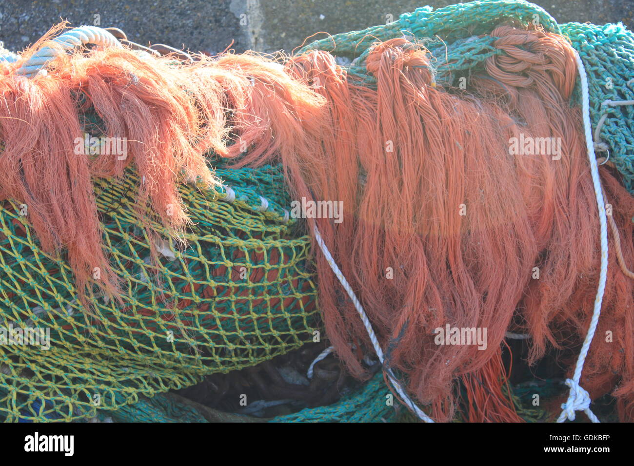 harbourside fishing equipment old nets ropes fenders Stock Photo - Alamy