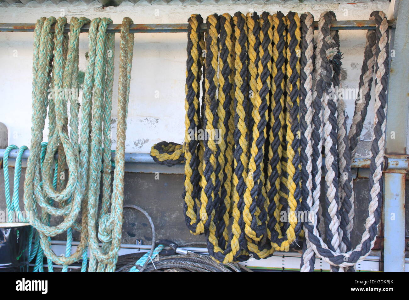 harbourside fishing equipment old nets ropes fenders Stock Photo - Alamy