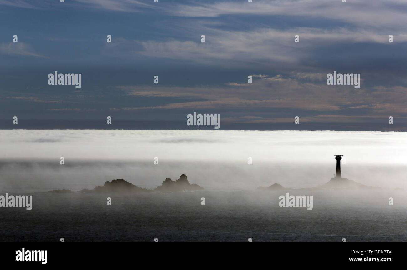 A view of the Longships Lighthouse off Land's End in Cornwall covered ...