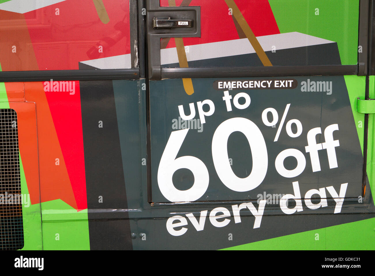 A Red & Green emergency exit, painted over with 60% Discount Signs. UK ...