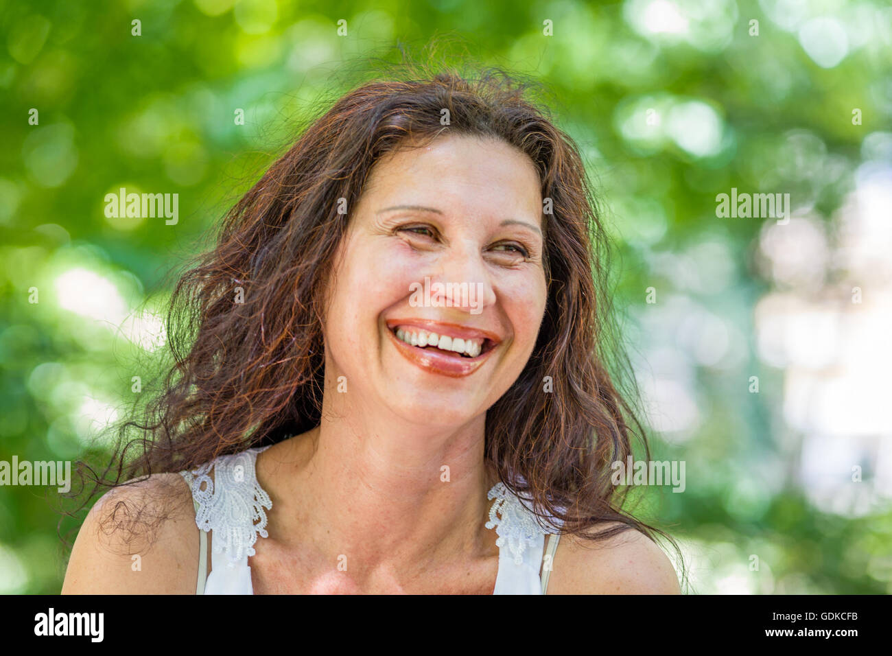 attractive woman laughs having fun Stock Photo - Alamy