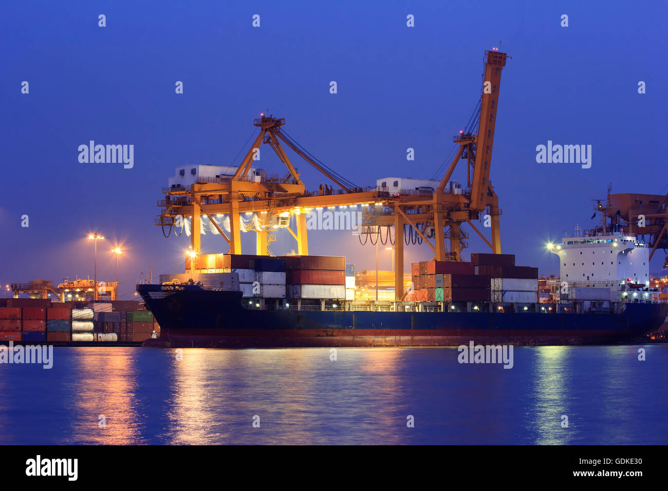 Industrial Container Cargo freight ship with working crane bridge in ...
