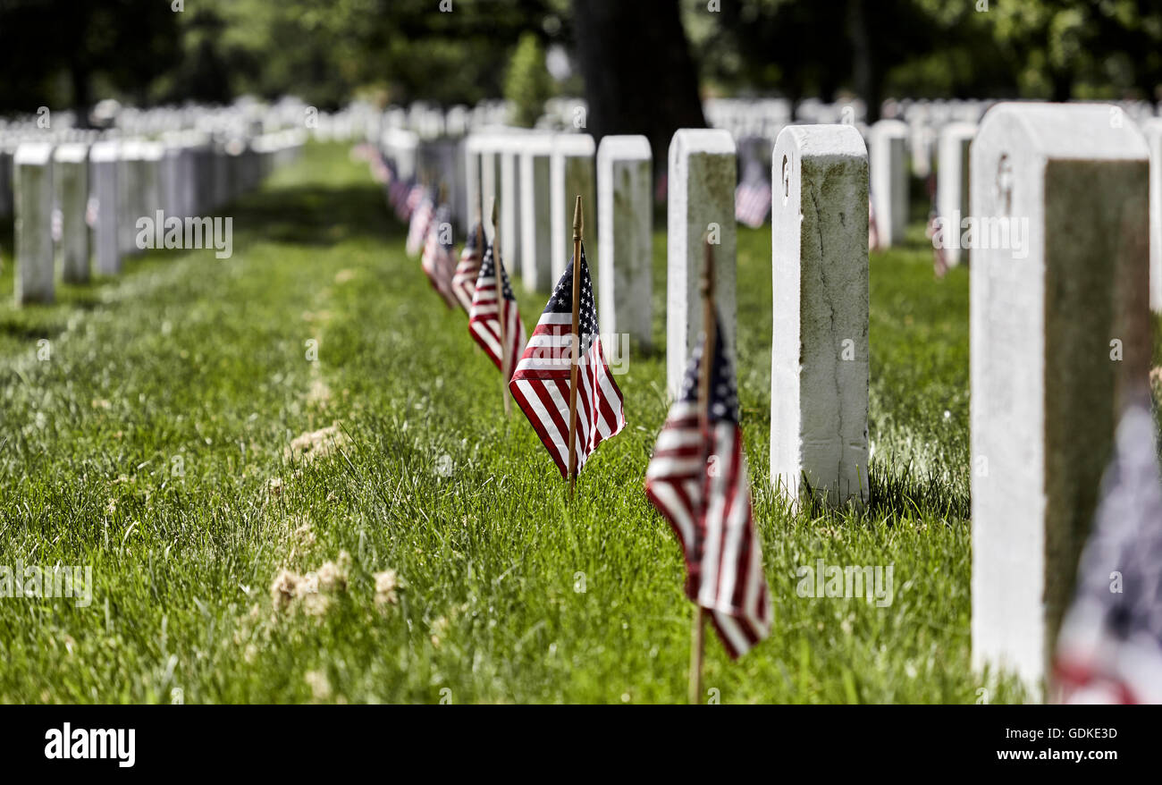 United States Flag on gravesites at Arlington National Cemetery on ...