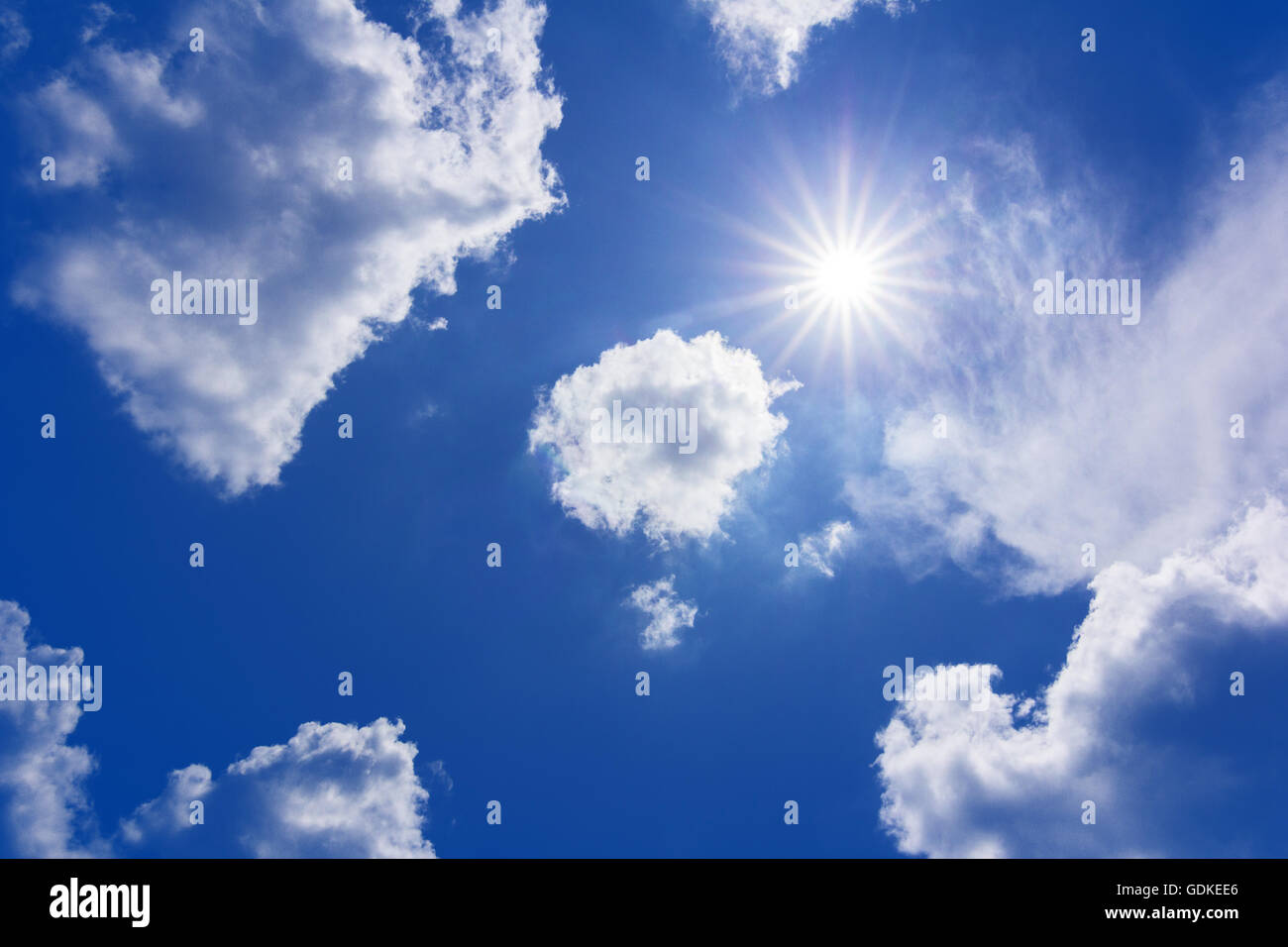 The sun shines bright in the daytime in summer. Blue sky and clouds ...
