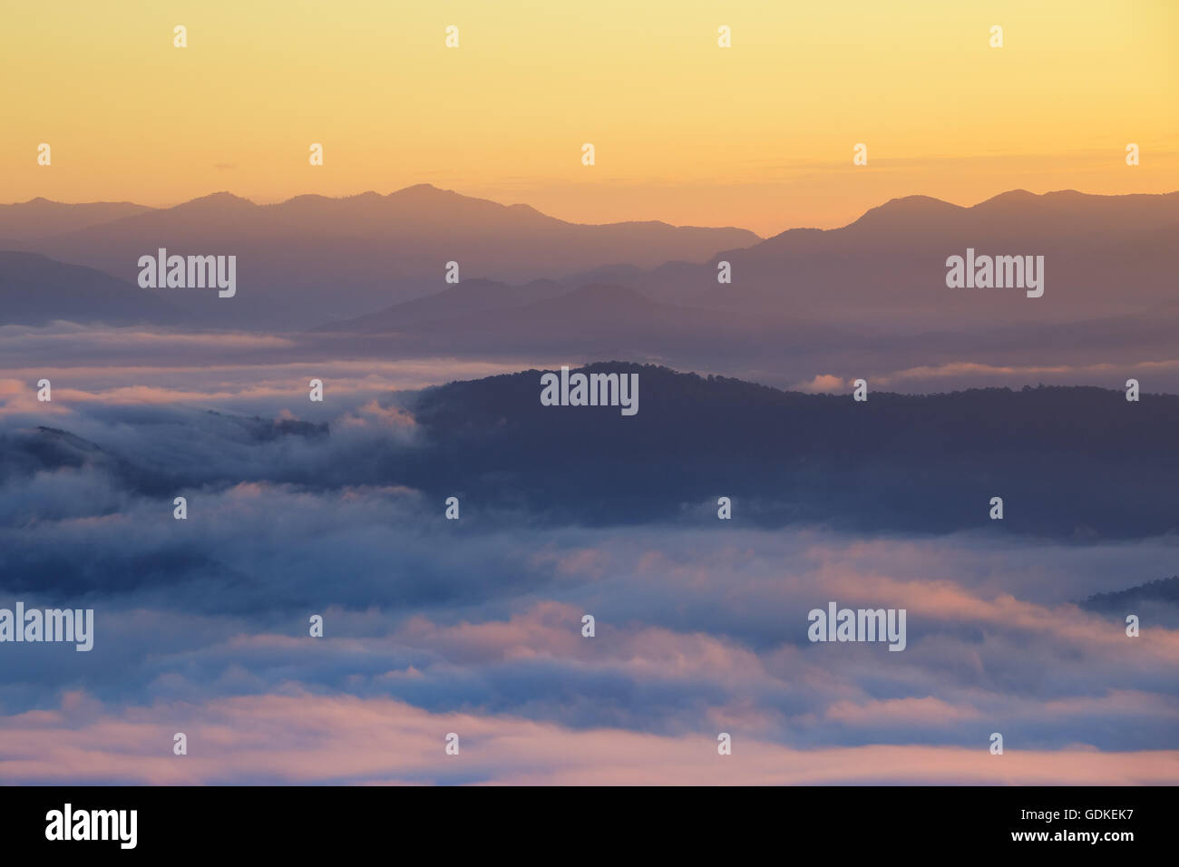 Mountain and mist in morning Stock Photo - Alamy