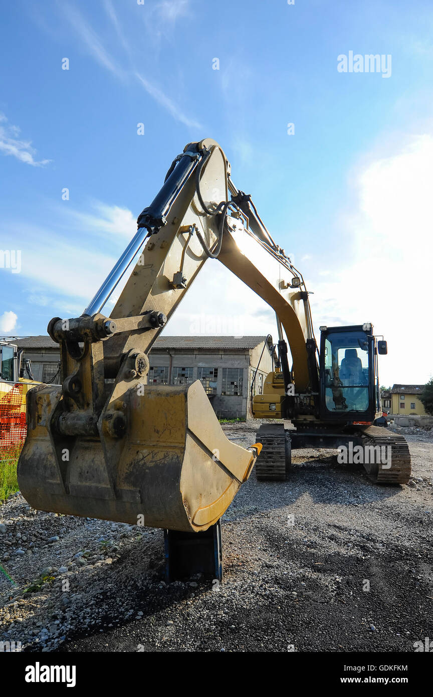Excavator shovel at construction site by building a road Stock Photo ...