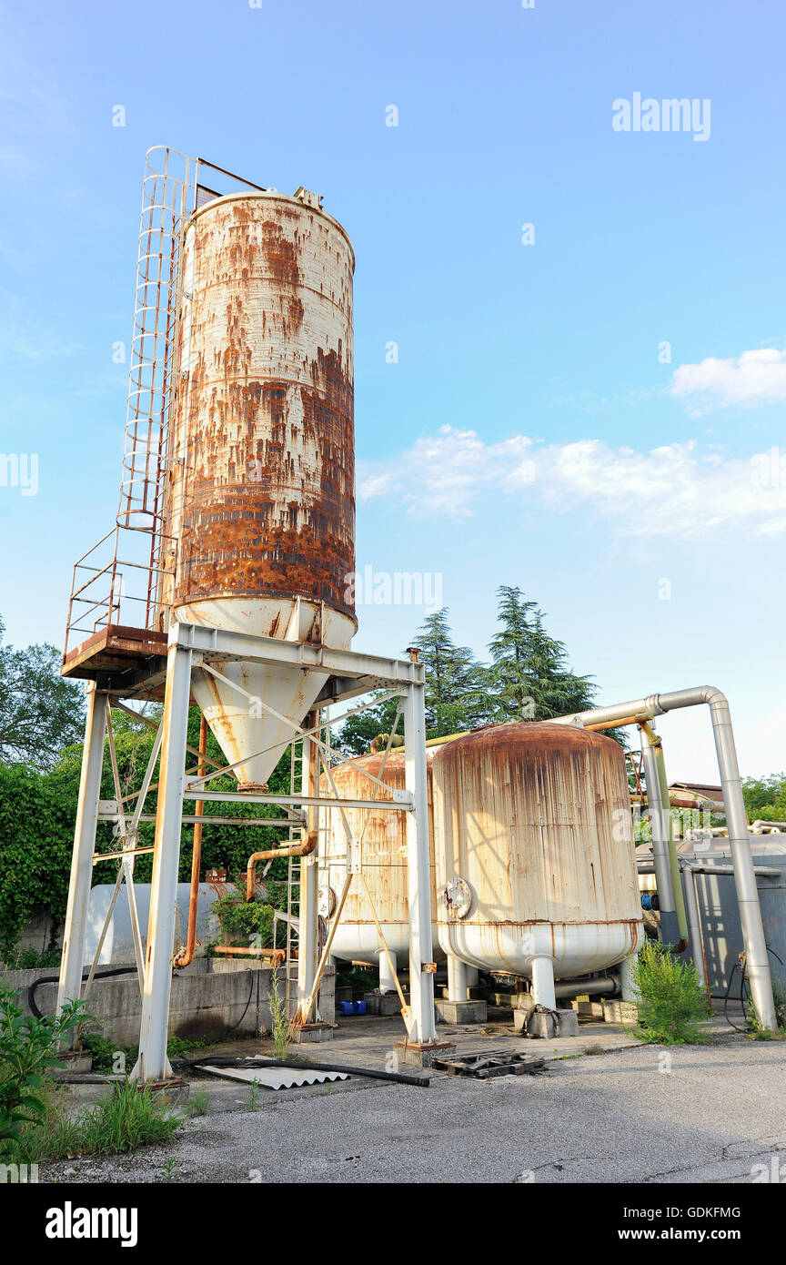 Old industrial chemical silos. Tank for small chemical plant Stock ...