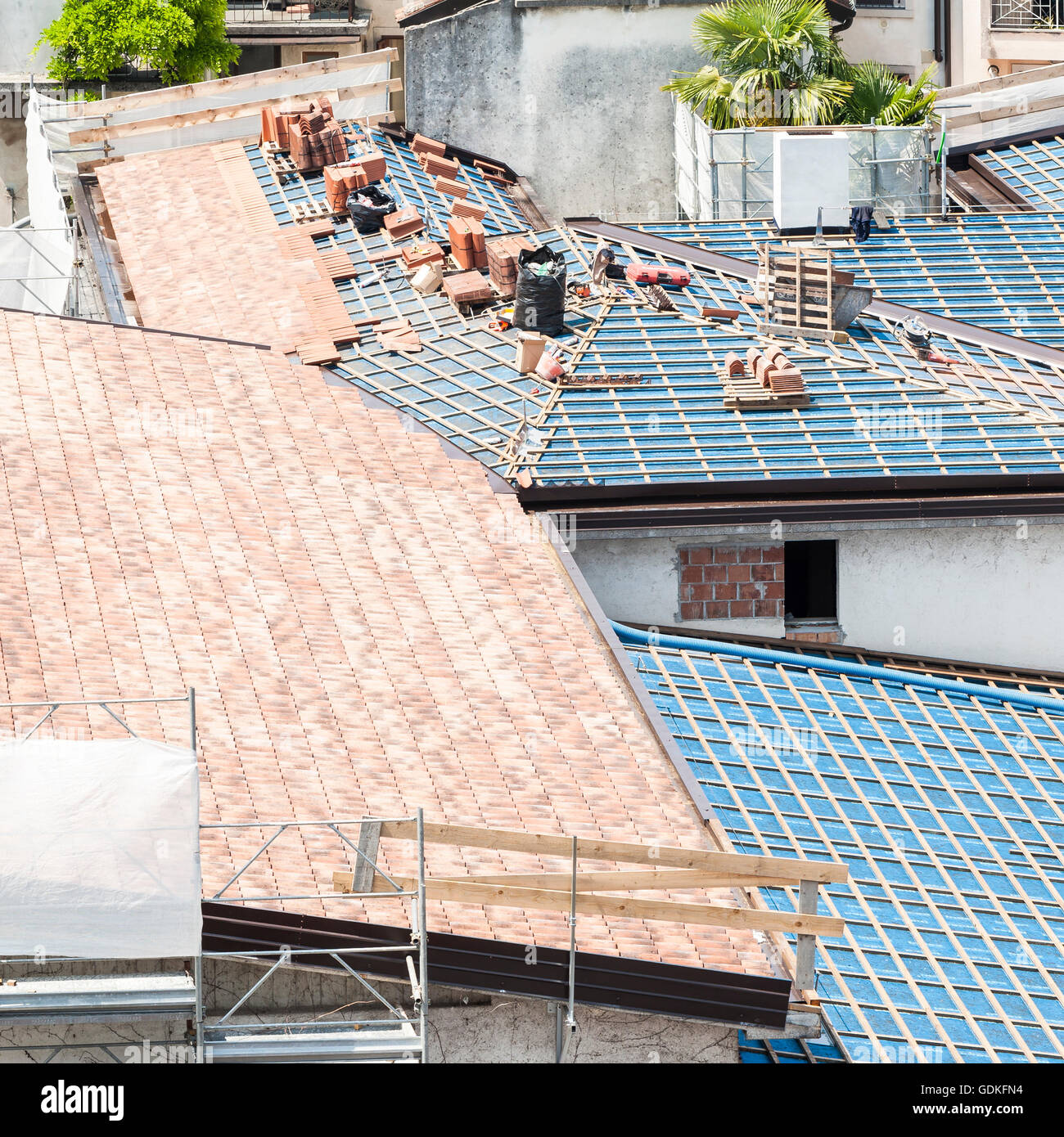 Construction site. Roof renovation. Pallets of shingles Stock Photo - Alamy