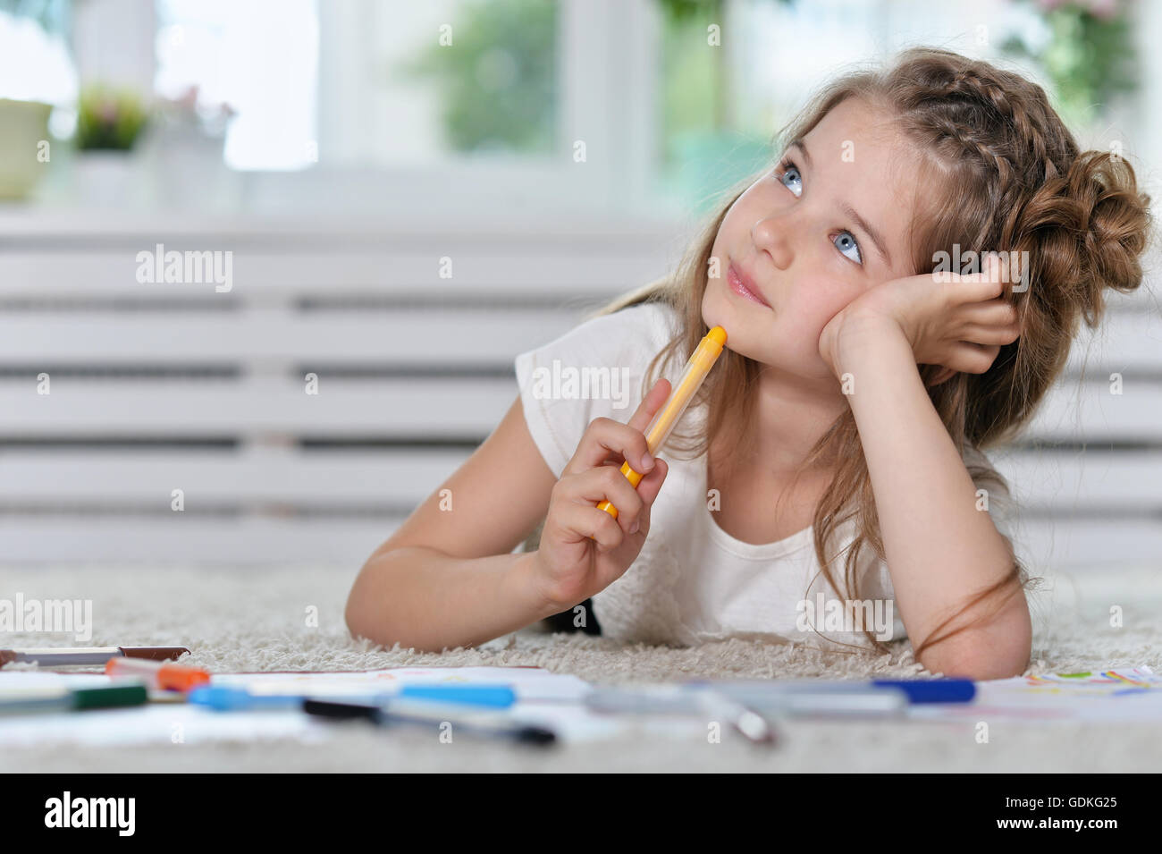 Little girl drawing at class Stock Photo - Alamy