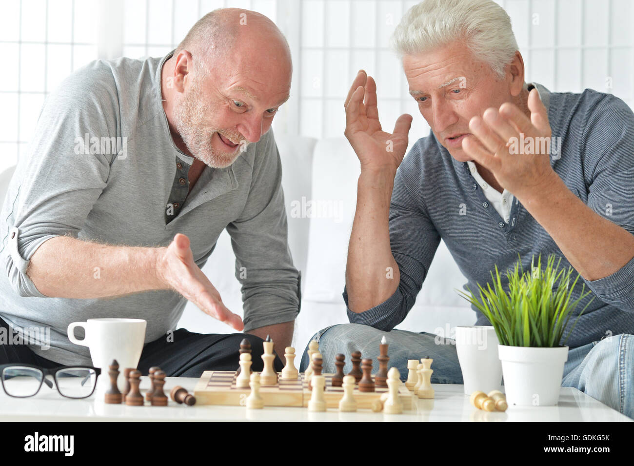 senior men playing chess Stock Photo - Alamy