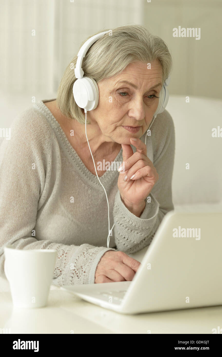 Elderly woman with laptop Stock Photo - Alamy