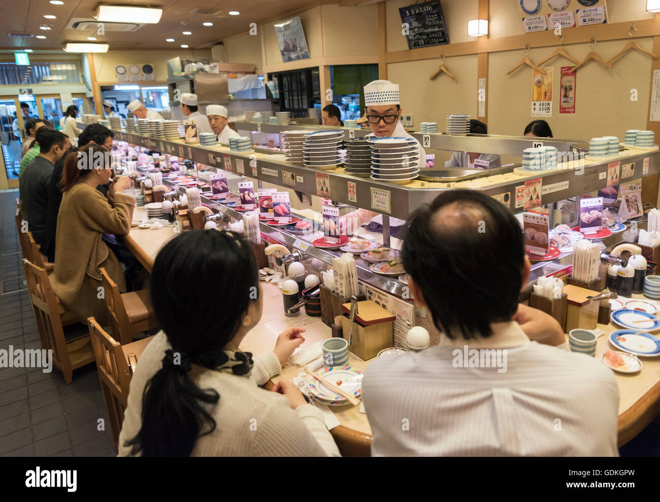 Kaiten-zushi restaurant serving sushi on rotating conveyor belt, Kyoto ...