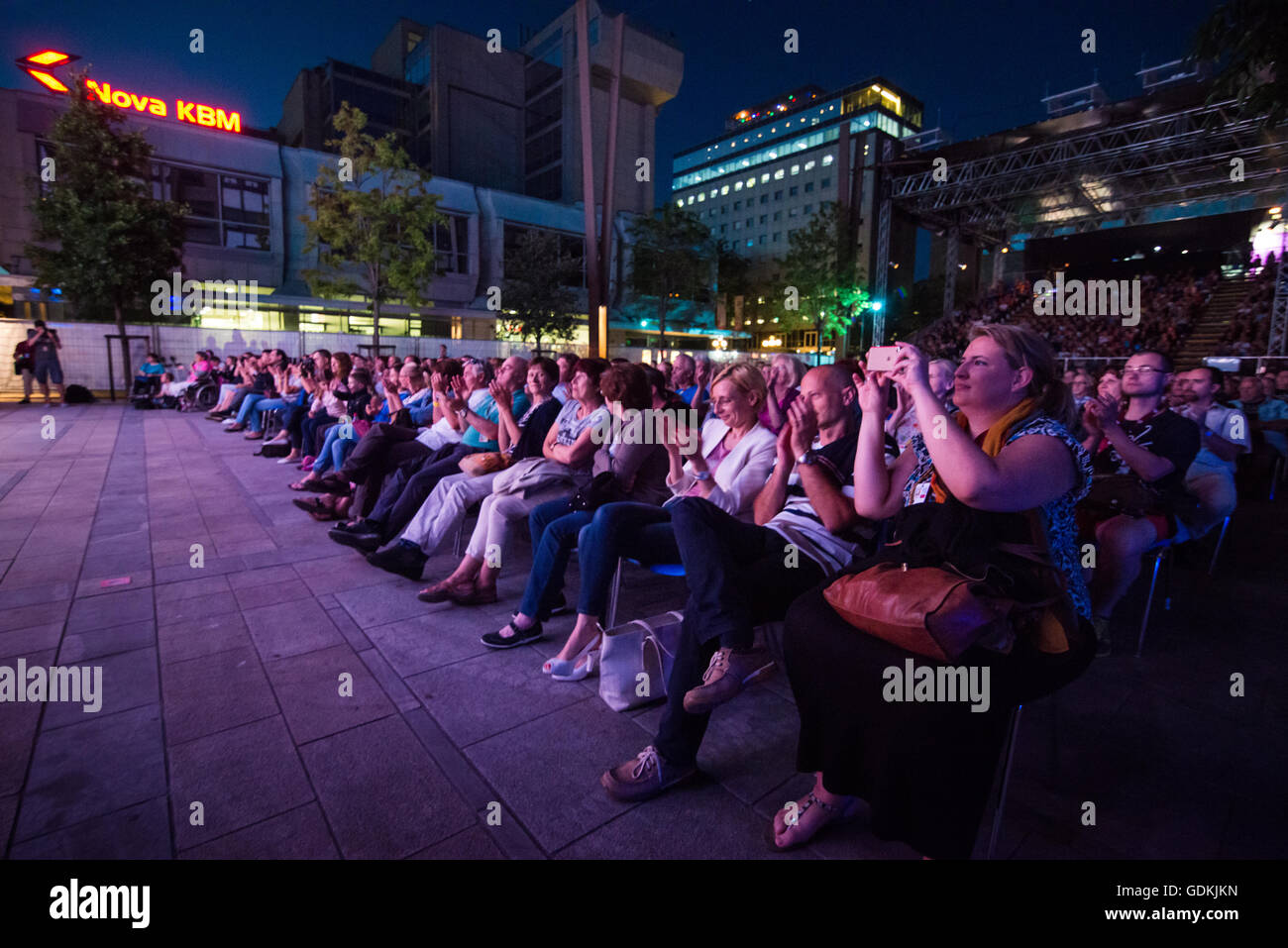 Audience clapping at opening performance of 28th Folkart International ...