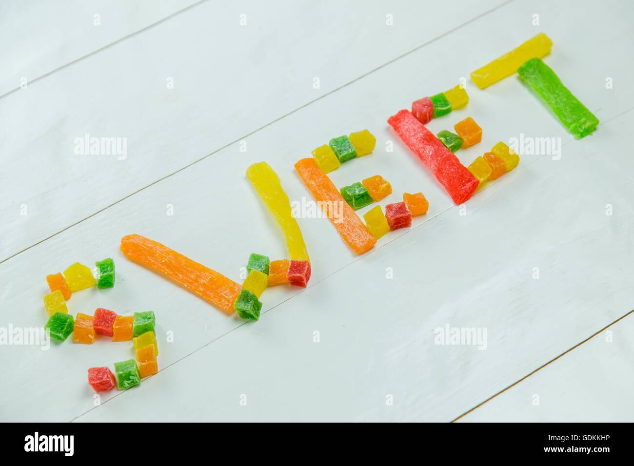 Sweet word with candied fruits Stock Photo - Alamy