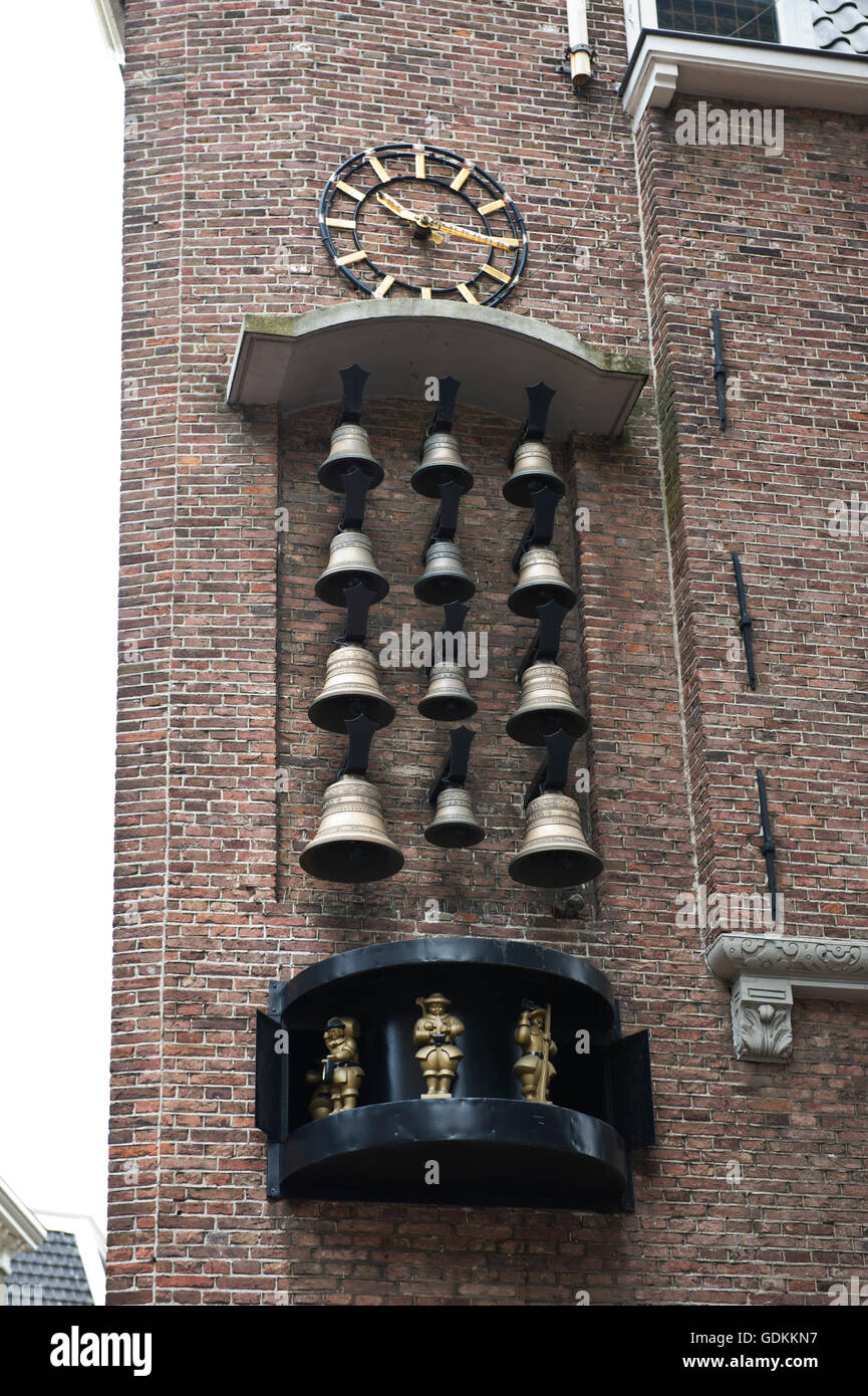 A series of bells of different sizes as part of a modern clock on a ...
