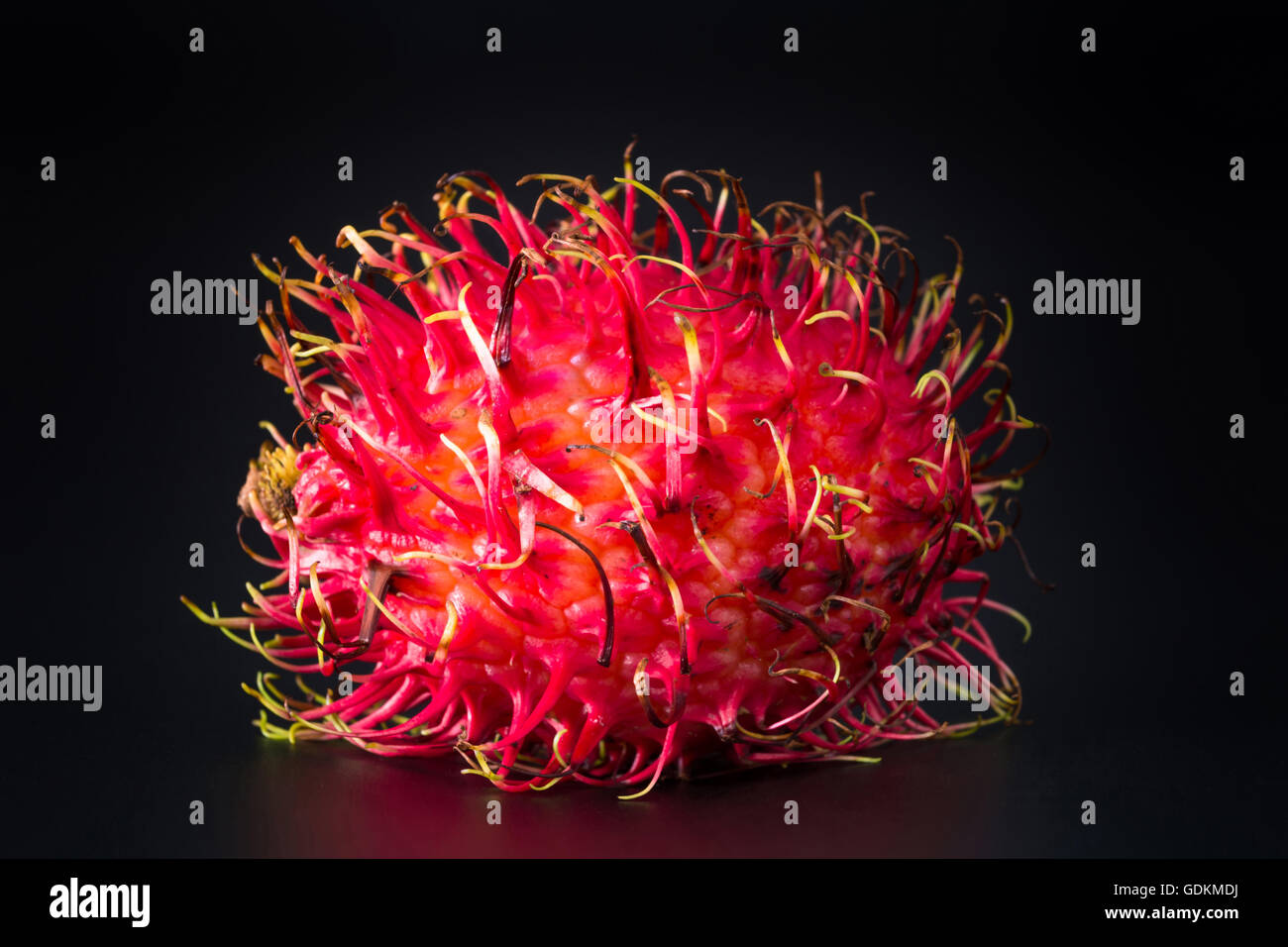 Thailand rambutan fruits black background Stock Photo - Alamy