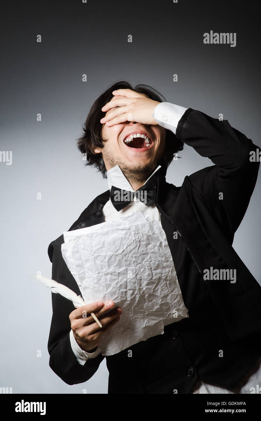 Funny writer with quill in vintage concept Stock Photo - Alamy